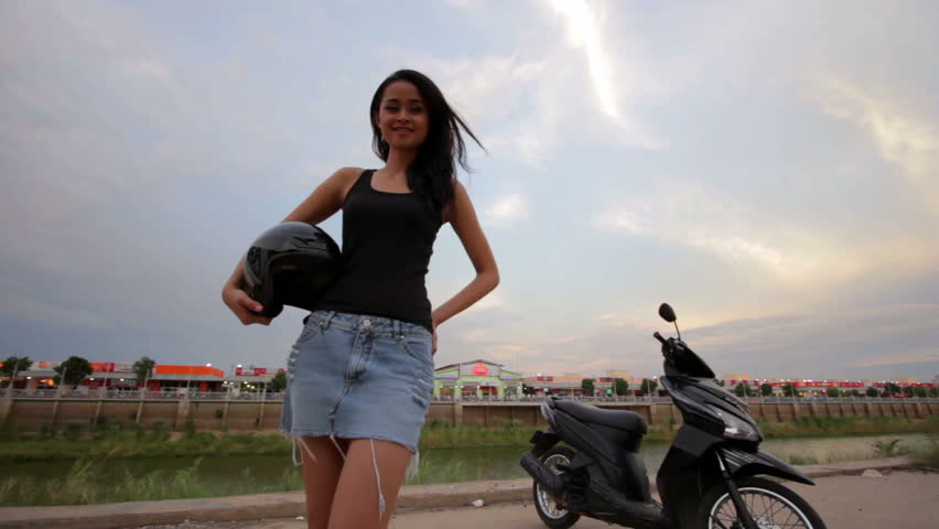 Sexy Asian Girl With Mini Skirt Next To Motorcycle Stock Footage Video
