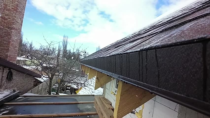 Rain Drops Falling From Roof's Eave During Rain Storm In Portland, Slow ...