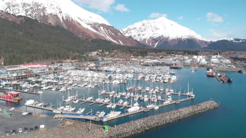 Boats in the harbor and Mountains in the Landscape in Seward, Alaska ...