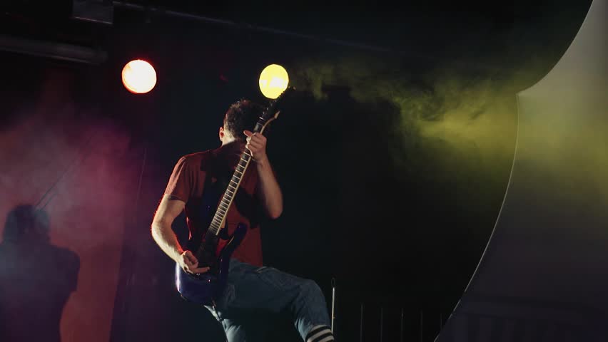 Stock video of rock star electric guitar jumping & | 10931447 ...