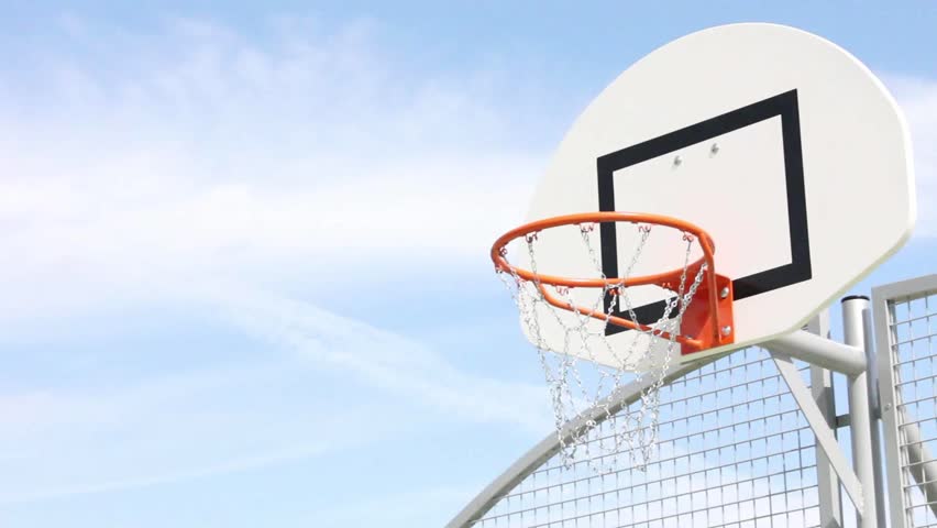 Stock video of throwing ball into a basketball hoop | 11514497 ...