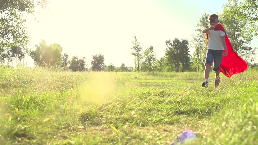 Superhero Kid Outdoors. Little Boy Wearing Super Hero Costume Runs In ...