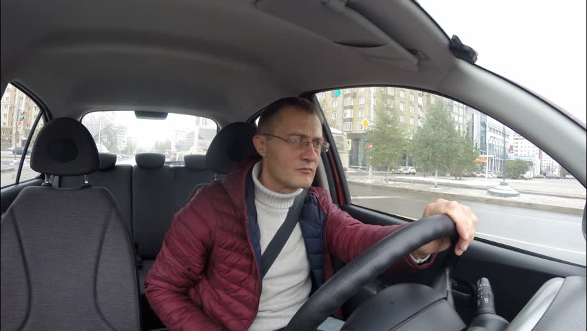 View From Inside A Sports Car To A Mature Man Driving Home After A Day ...