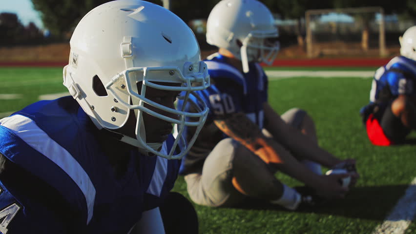 Close Up Of A Football Running Back Getting Tackled By Two Defenders ...