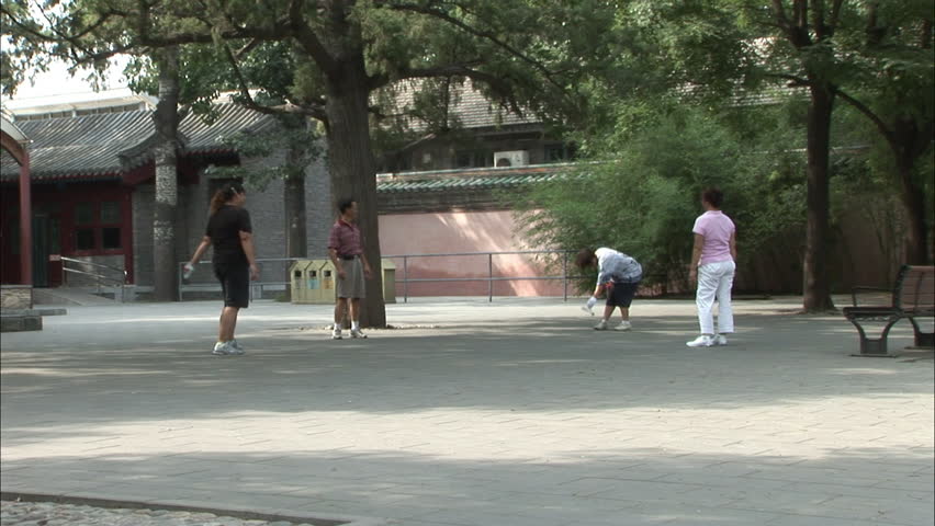 Beijing, China - August 2009: Chinese Men Kicking A Shuttlecock As Part ...