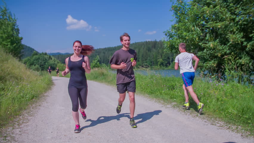 Young Multi Ethnic Running Partners Keeping To A Fitness Program ...