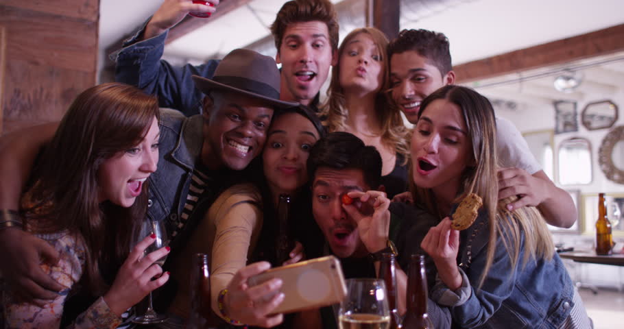 Smiling Group Of Friends Celebrating Evening Event Taking Selfie At ...