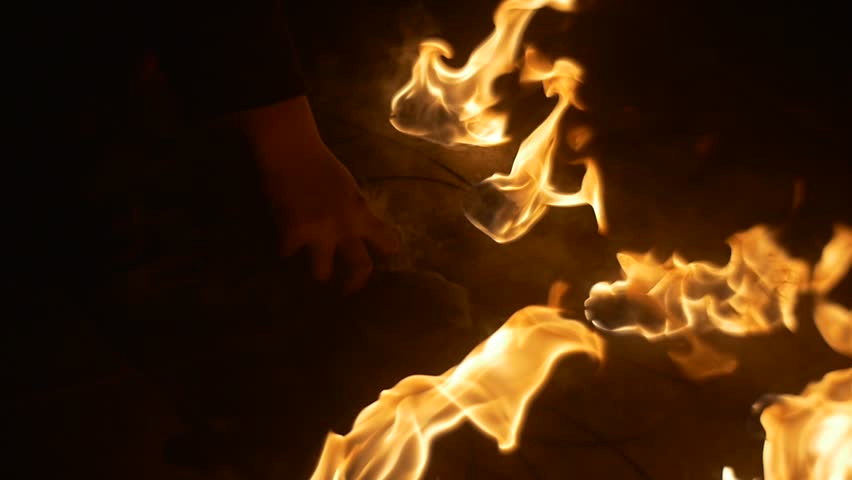 Fire Torch Is Burning, Slow Motion, Male Hand Appears And Puts A Few ...