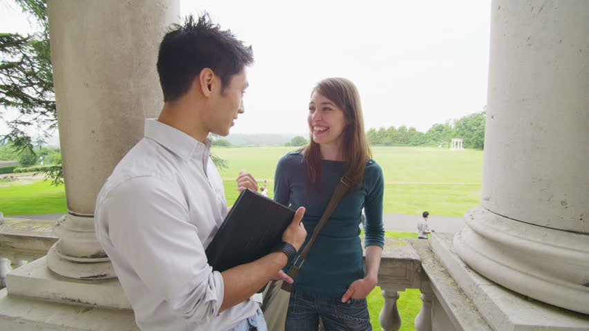 Students Flirting Together Outside On College Campus Stock Footage ...