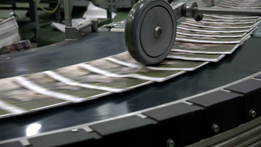 Newspapers Flow Along an Assembly Stock Footage Video (100% Royalty ...