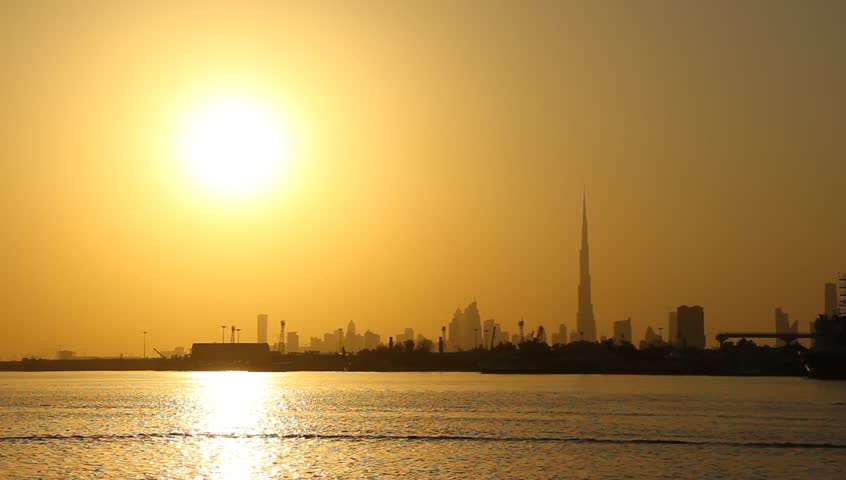 Golden Sunset Sky, Blazing Sun, Dubai Creek And Skyline Afar. Burj ...