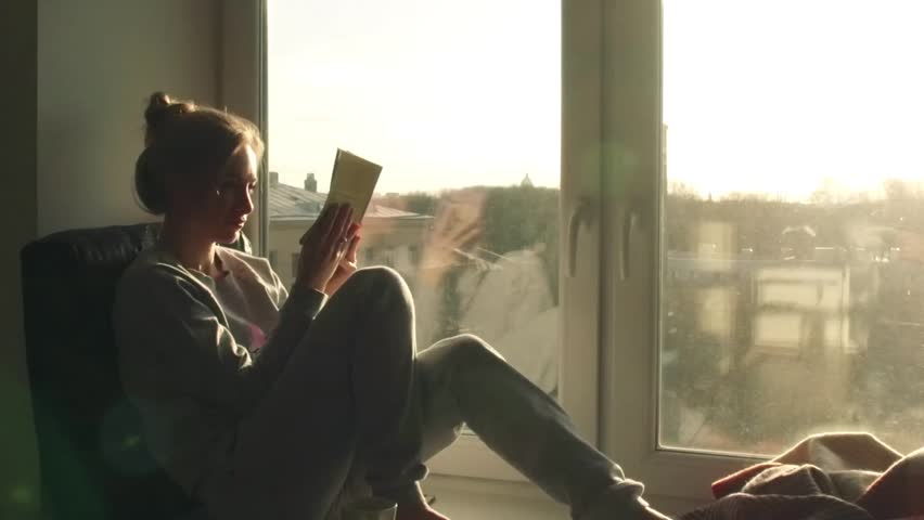 Serious Face Girl Sit On Windowsill Watch Through Window And Read Book ...