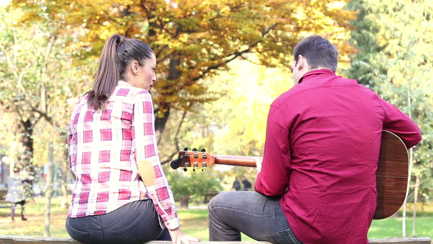 Stock Video Clip of Back view of handsome man playing guitar | Shutterstock