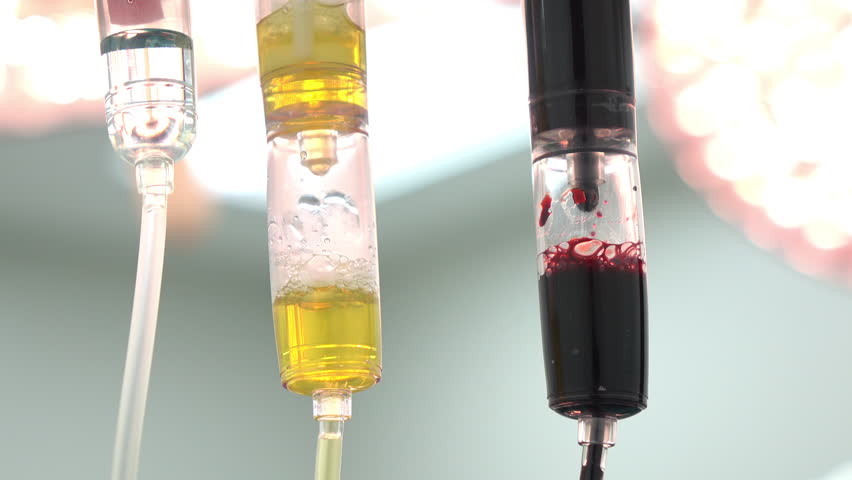 Stock video of doctor give intravenous fluid, packed red | 16877767 ...