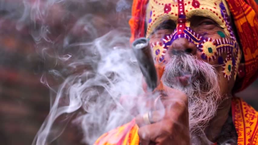 Portrait of sadhu smoking marijuana out of 的库存视频影片 | Shutterstock