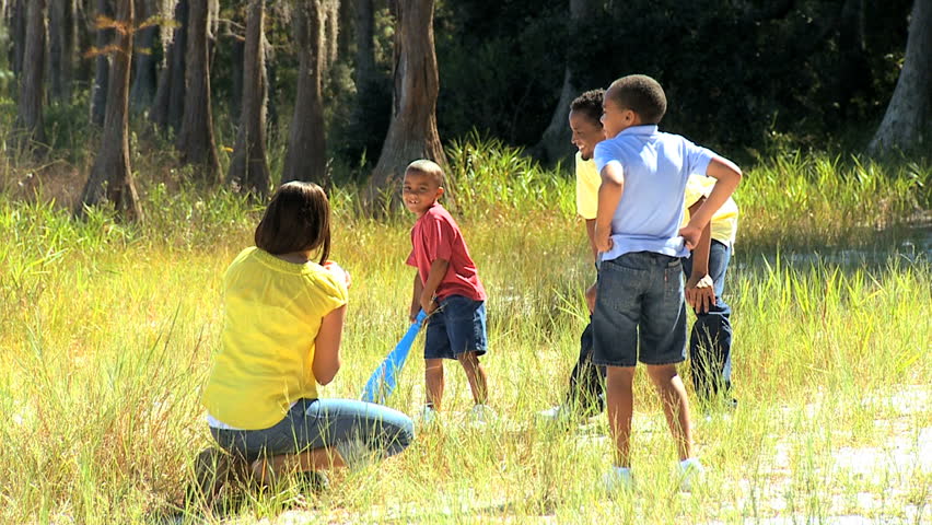 Healthy Young Ethnic Family Having Fun Playing Baseball Together In The ...