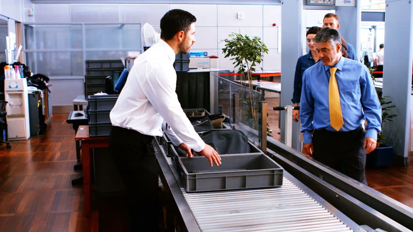 Stock video of male security staff assisting commuters with | 19787077 ...