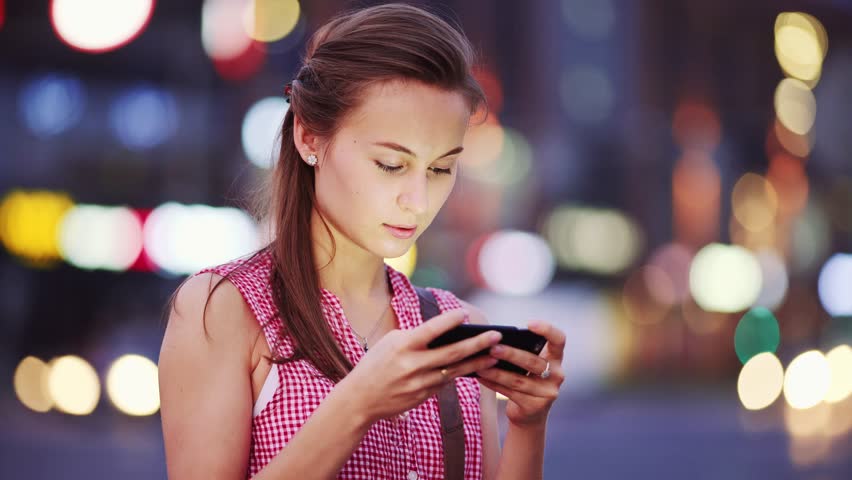 Woman Using Smart Phone At Night In City. 4K. Attractive Young Woman ...