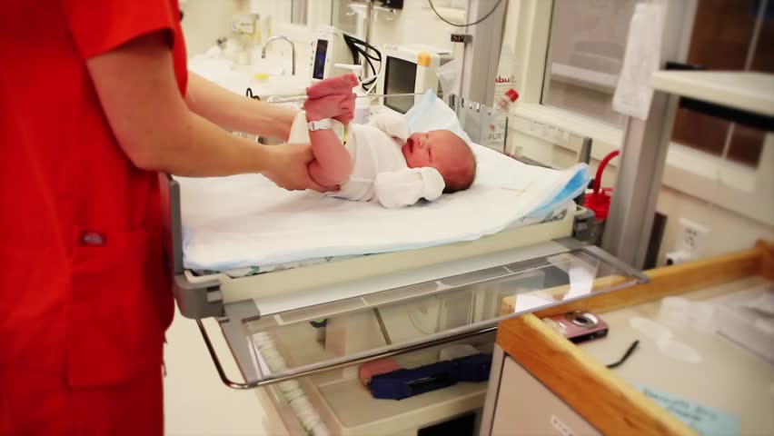 A Newborn Baby At The Hospital Born Just Minutes Before Being Cleaned ...