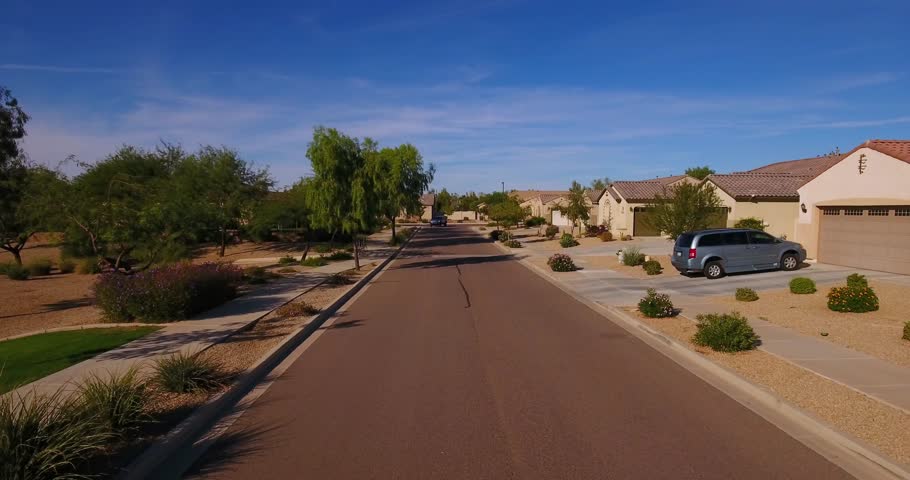 A Truck Drives Past Homes In A Typical Arizona Neighborhood. Phoenix ...