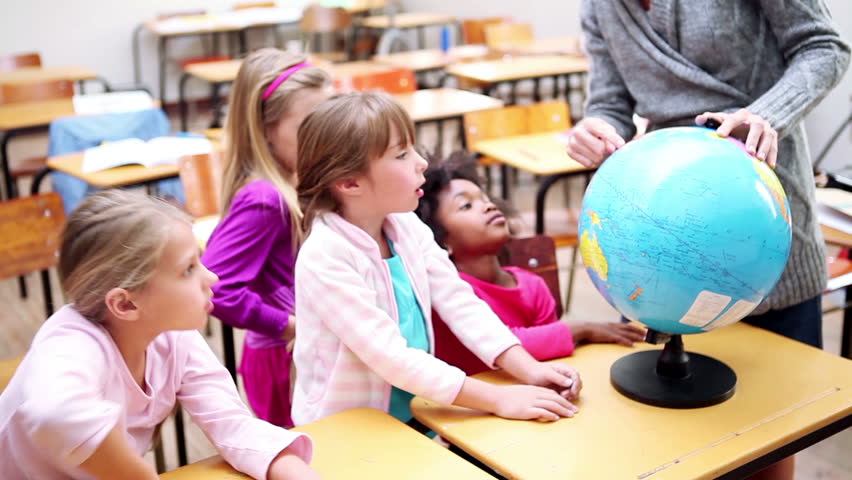 Cute Children Looking At A Globe In The Classroom Stock Footage Video ...
