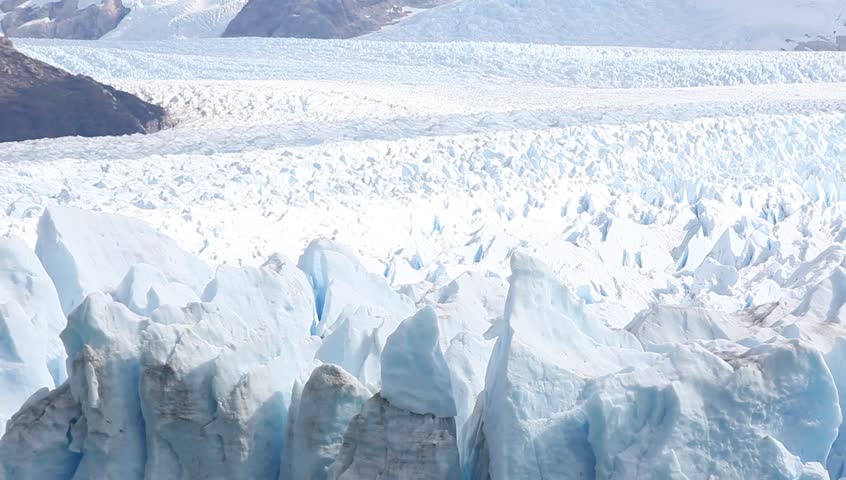 Pan Across A Vast Arctic Glacier With Ice Stretching Into The Distance ...