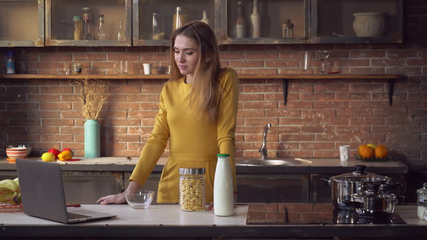 Happy Lady Cooking Breakfast In Kitchen. Smiling Redhead Female Prepare ...