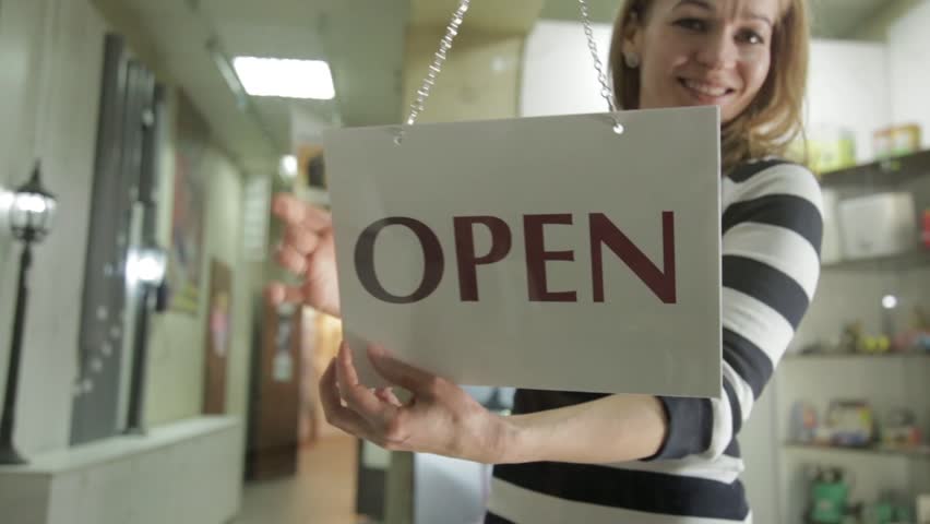 Woman Flipping Over Cafe Closed Sign Stock Footage Video 4219543 ...