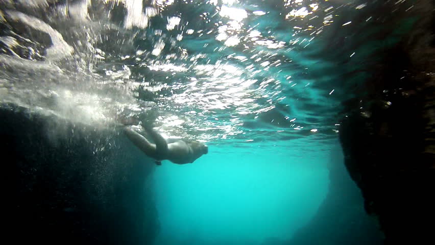 Stock Video Clip of Diver and rocks Girl diving between the rocks ...