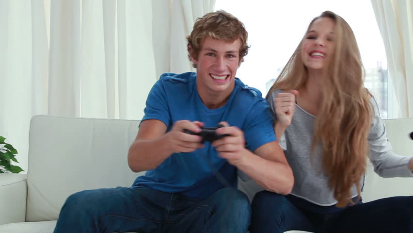 Stock video of smiling couple playing video games together | 2903347 ...