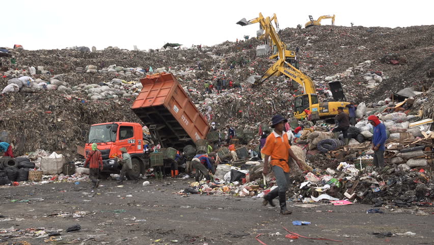 JAKARTA, INDONESIA - APRIL 2017: Workers At Jakarta Garbage Dump Look ...