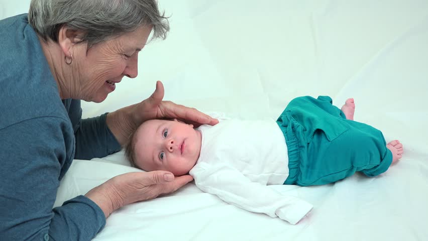 Grandmother Touching Newborn, Baby Look Stock Footage Video (100% ...