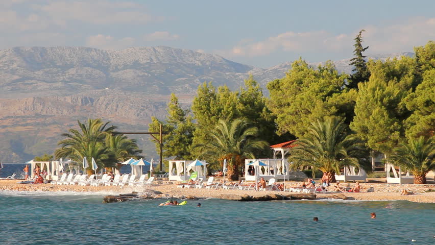 Arkivvideo people on the beach, sunbathe and | 3565367 | Shutterstock