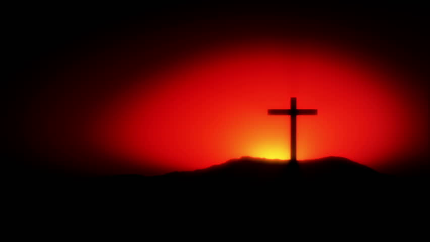 Sun Moves Behind A Silhouetted Christian Cross On A Hillside With A ...