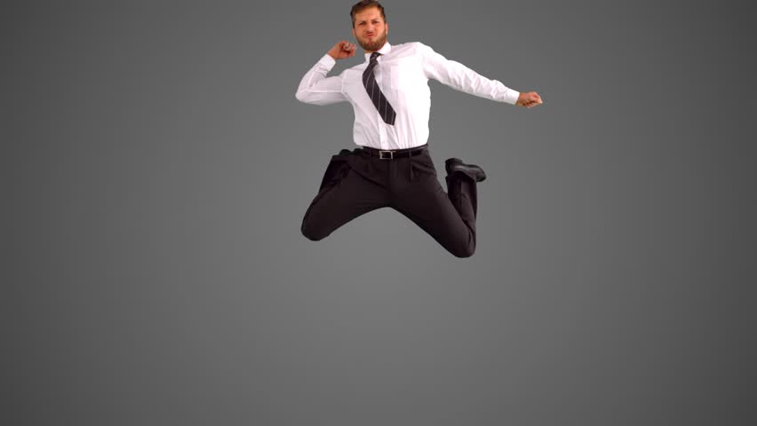 Businessman Leaping On Grey Background In Slow Motion Stock Footage ...