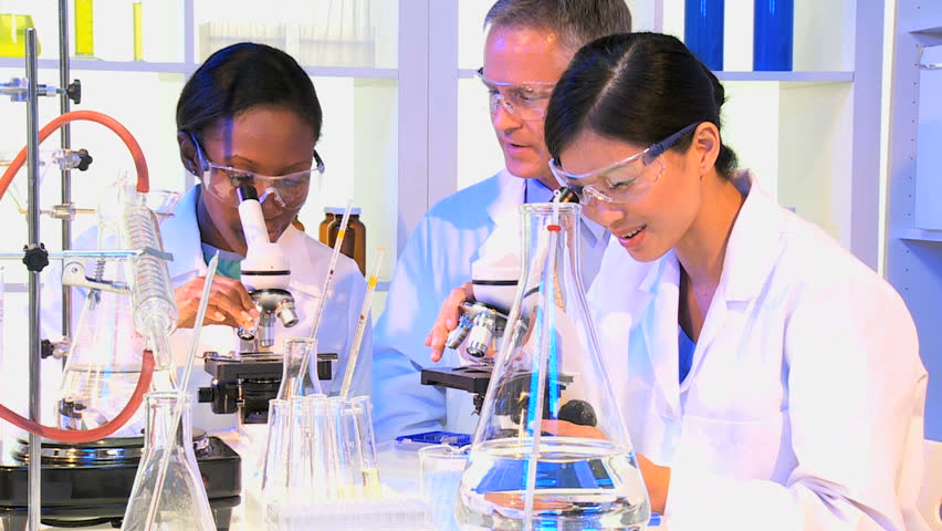 Student Doctors Examining Medical Research Specimens In Modern ...