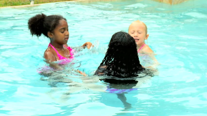 Stock Video Clip of Little multi ethnic friends swimming together ...