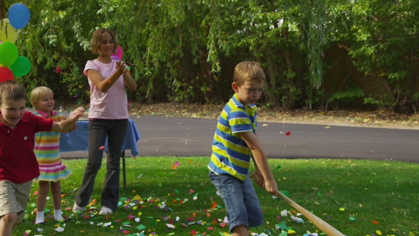 Stock video of boy hitting a pinata at party | 4589537 | Shutterstock