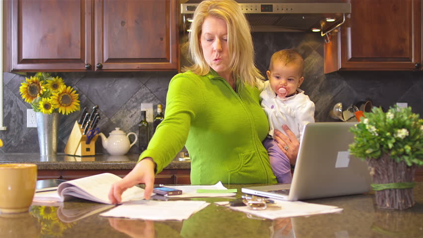 Stock video of a busy mom tries to multitask | 4637327 | Shutterstock