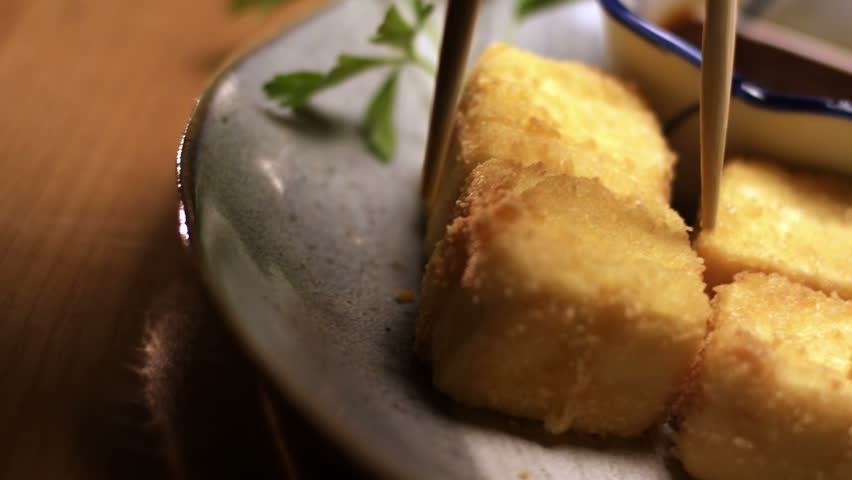 Fried Tofu Squares Dipped in stock-videoer (100 % royaltyfri) 4680617 ...