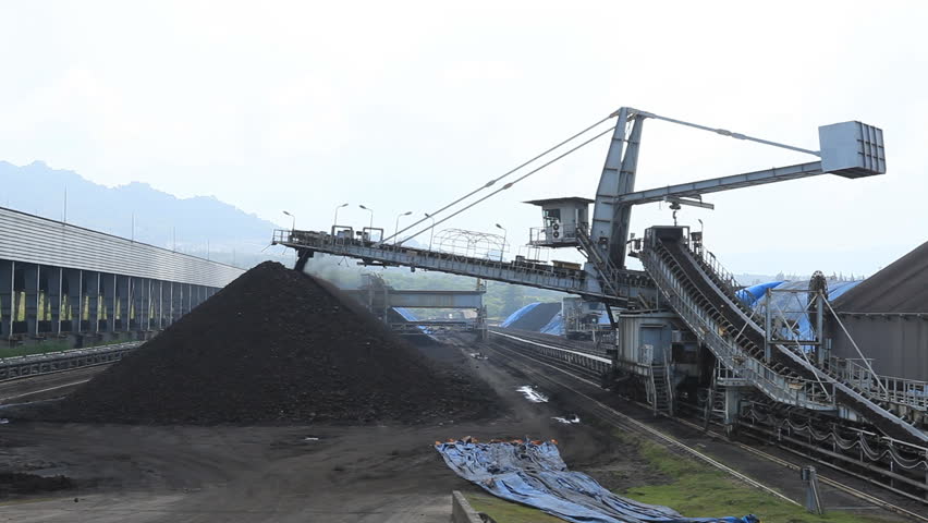 Silhouette Of Coal Being Stockpiled With The Sun Behind Stock Footage ...