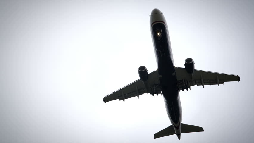 Plane Landing Flying Overhead in Stock Footage Video (100% Royalty-free ...