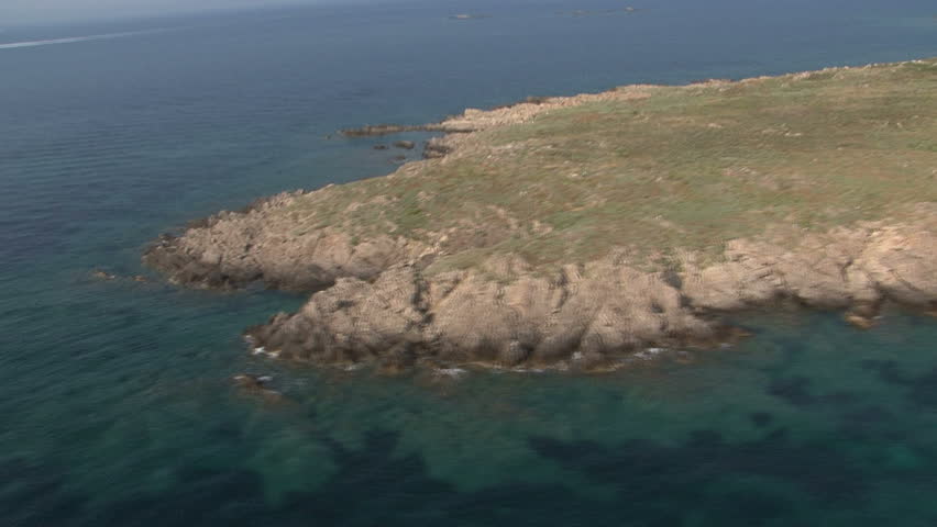 Low Aerial Shot Skimming The Surface Of The Turquoise Waters Of The ...