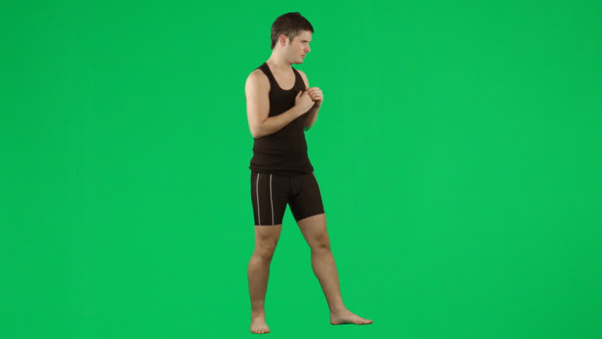 Stock Video Clip of Young man boxing against green screen footage ...