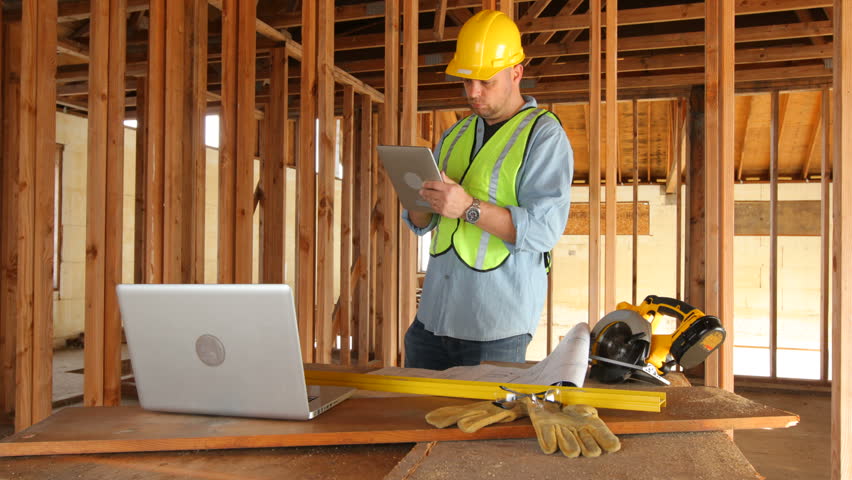 Stock video of construction worker using digital tablet on | 5674487 ...