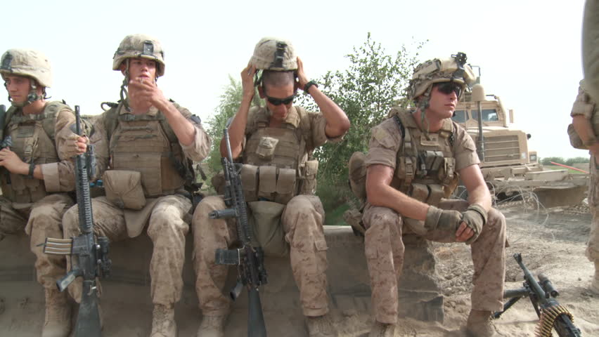 Afghanistan, Circa 2008: U.S. Marines On Patrol Stop Along The Village ...