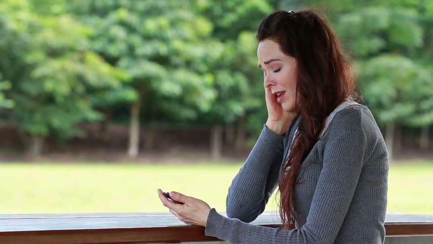 A Woman Gets Very Angry And Annoyed After Receiving A Text Message On ...