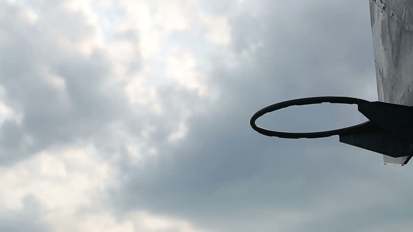 Slow Motion Basketball Player Silhouette Scoring On An Outdoor Court ...