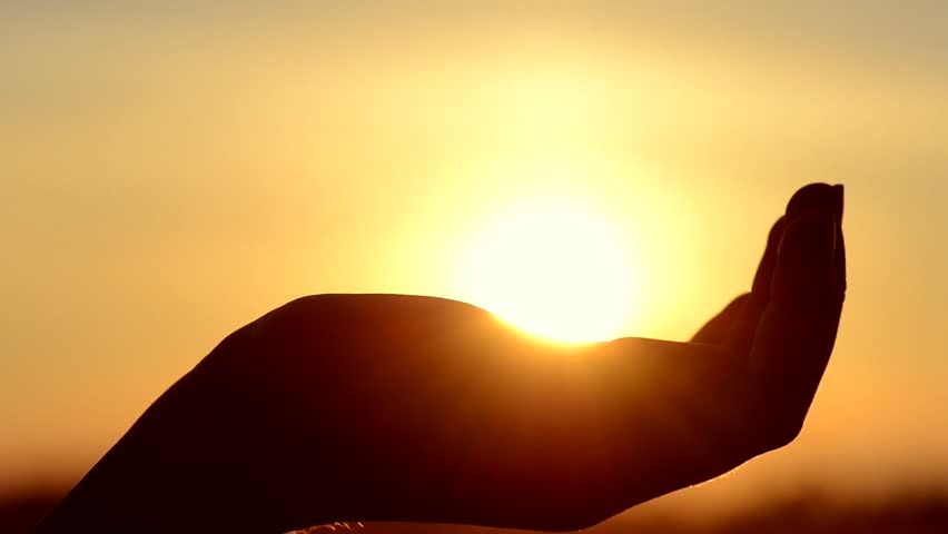 Hand Catching a Sun Against Stock Footage Video (100% Royalty-free ...
