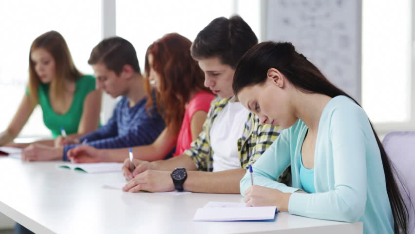 High School Students Quietly Working, Doing Their Assignments ...
